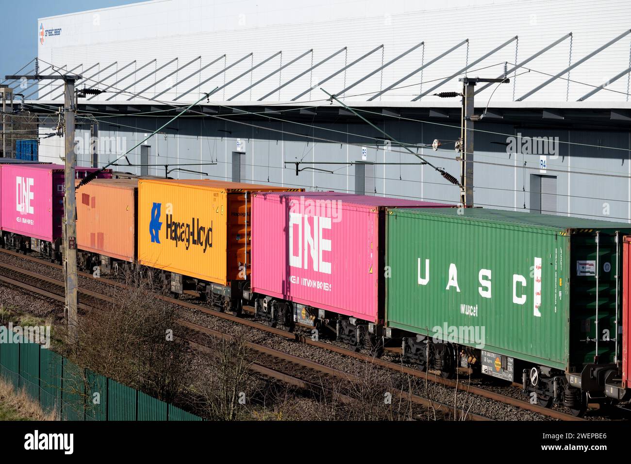Shipping containers on a train, Northamptonshire, UK Stock Photo - Alamy