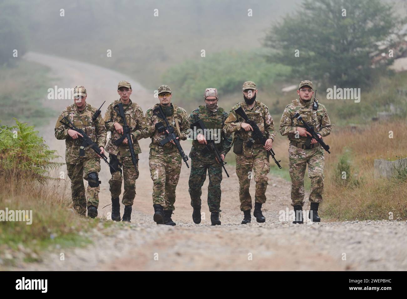 A disciplined and specialized military unit, donned in camouflage ...