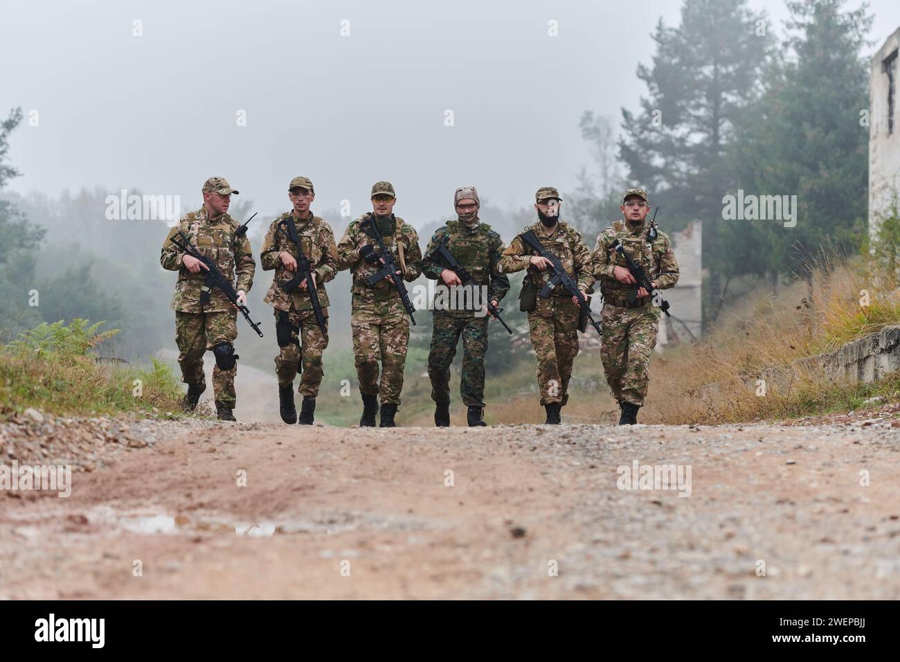 A disciplined and specialized military unit, donned in camouflage ...