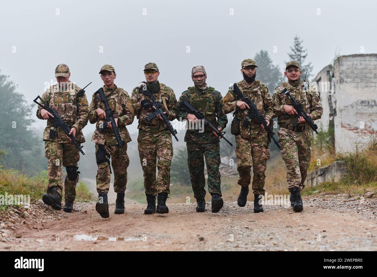 A disciplined and specialized military unit, donned in camouflage ...