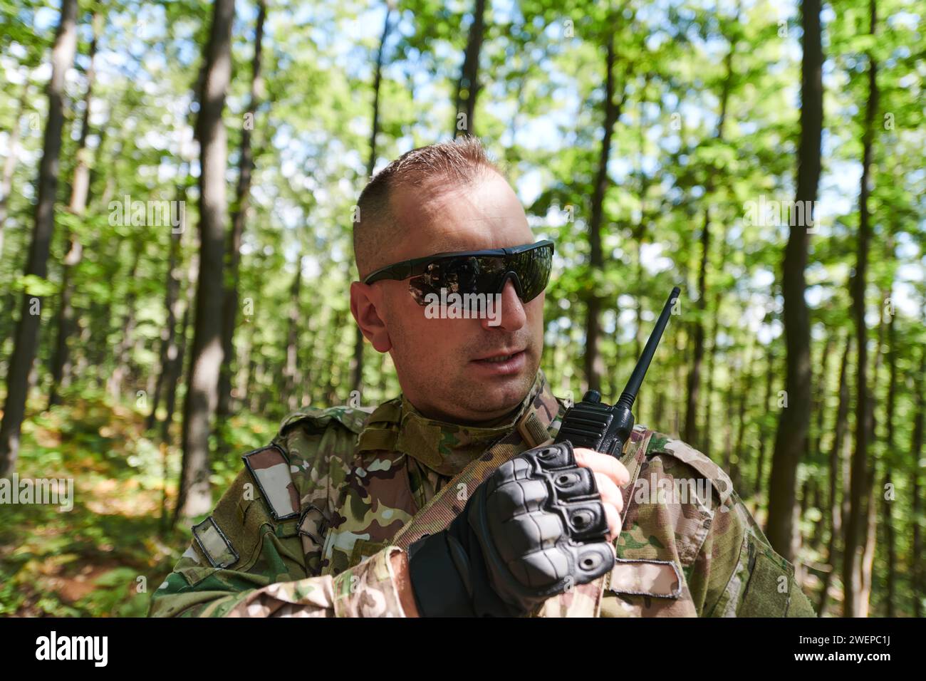 A military major employs a Motorola radio for seamless communication ...