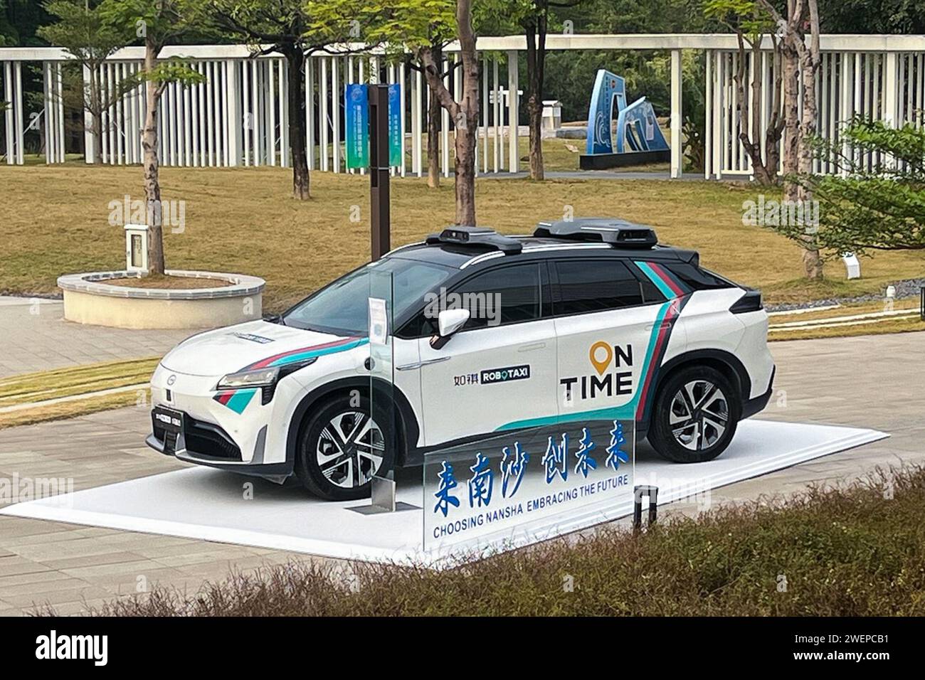 Nansha District, China. 03rd Dec, 2023. A Robotaxi sits in front of the ...