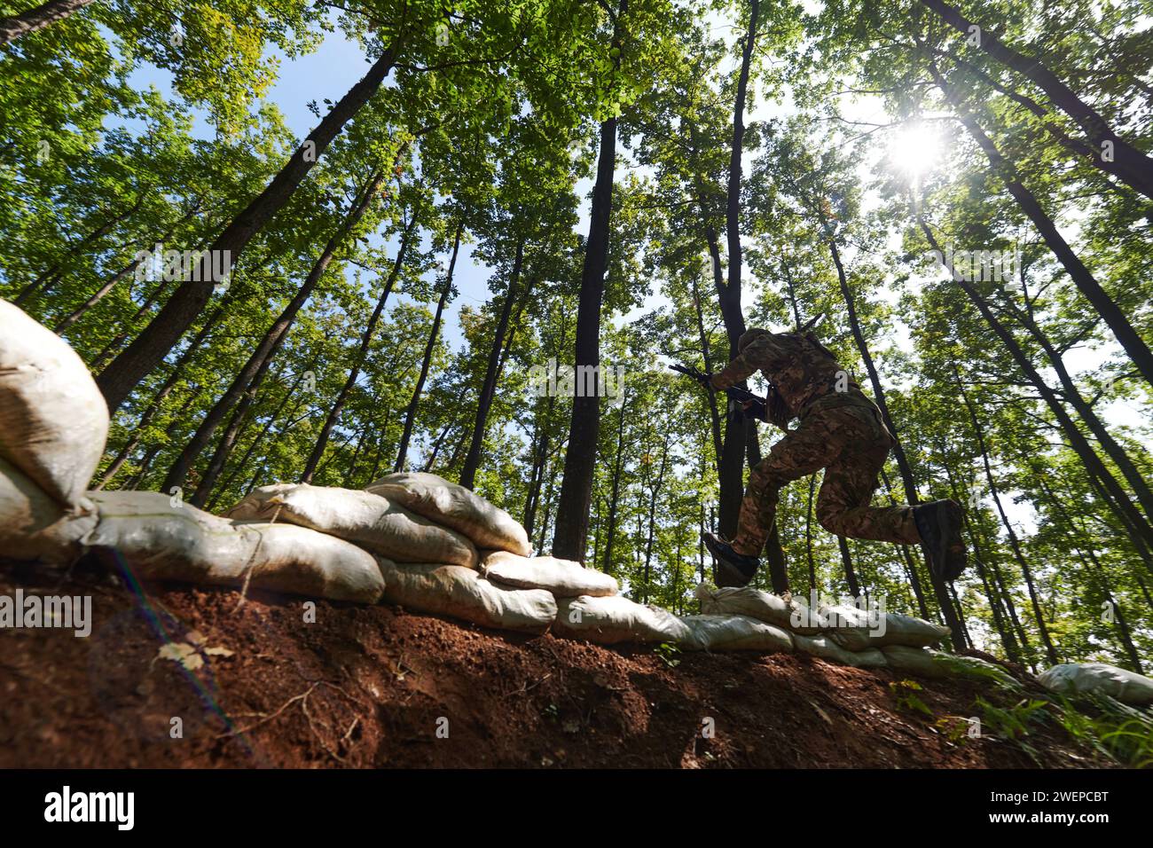 An elite soldier adeptly clears military barriers in the perilous ...