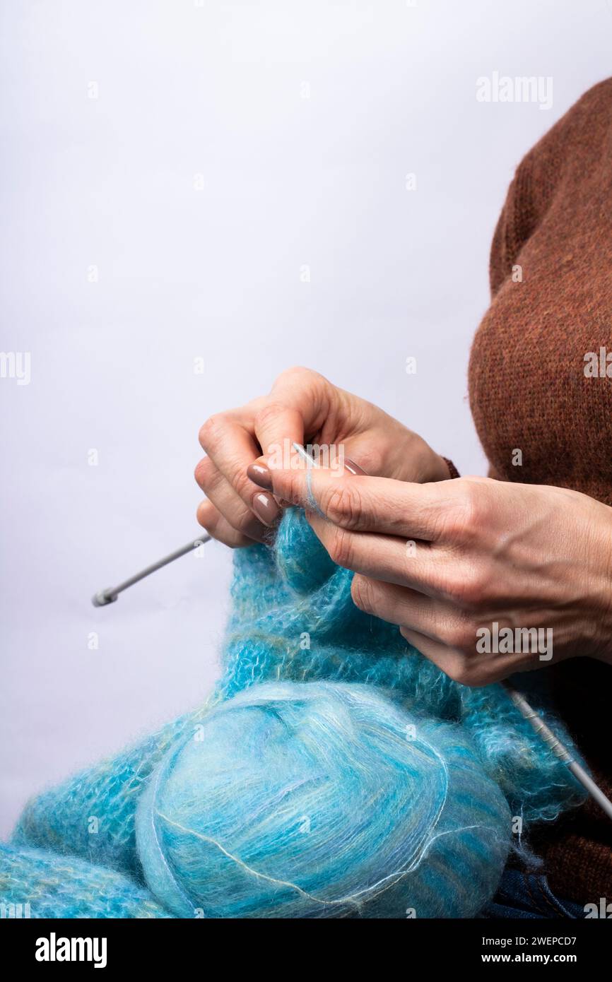 Close-up of hands knitting. Process of knitting. Hand made Stock Photo ...