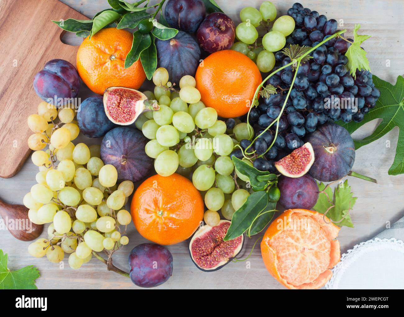 Fruit set on table board. Healthy eating Stock Photo - Alamy