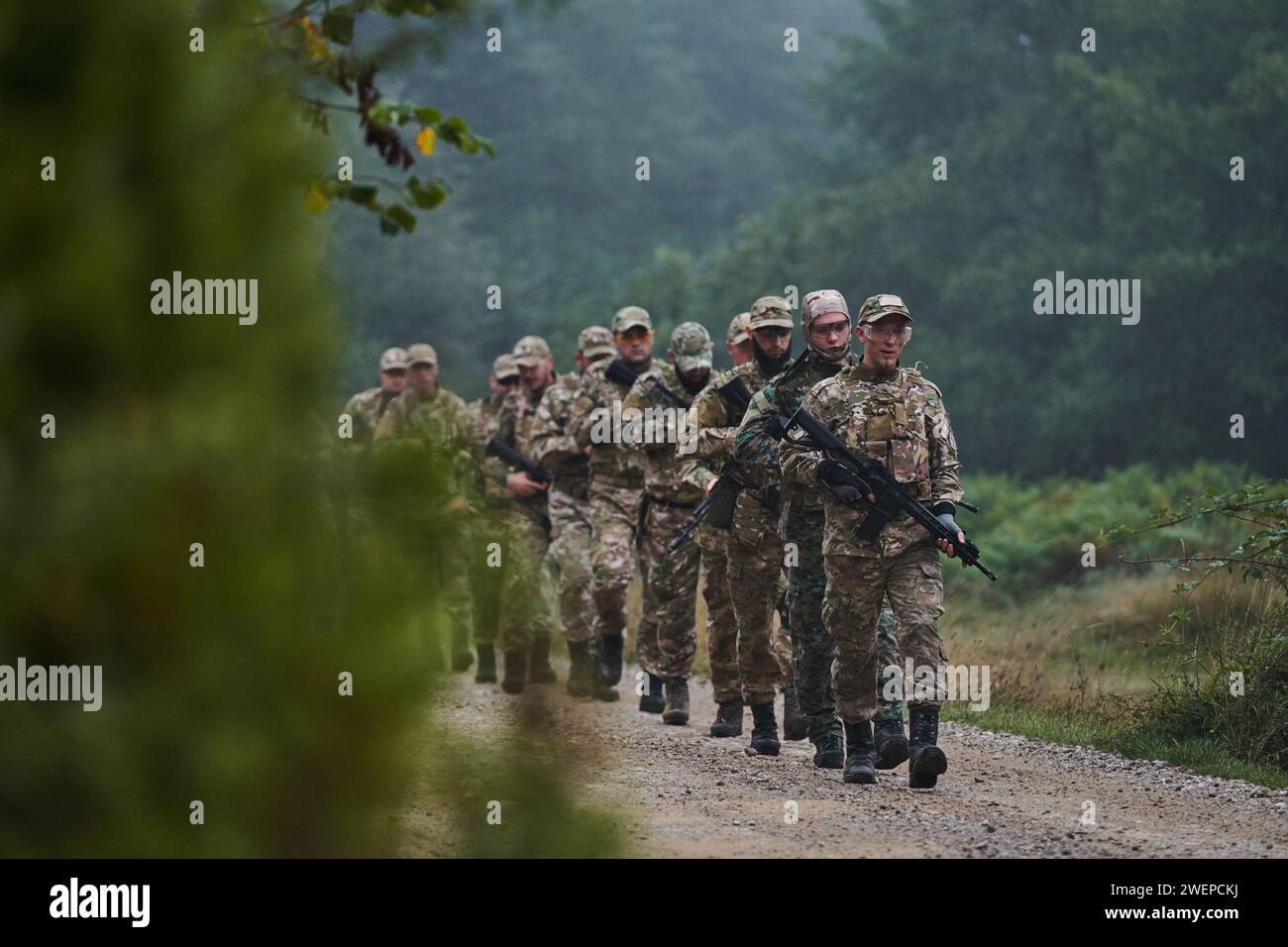 An elite military unit, led by a major, confidently parades through ...