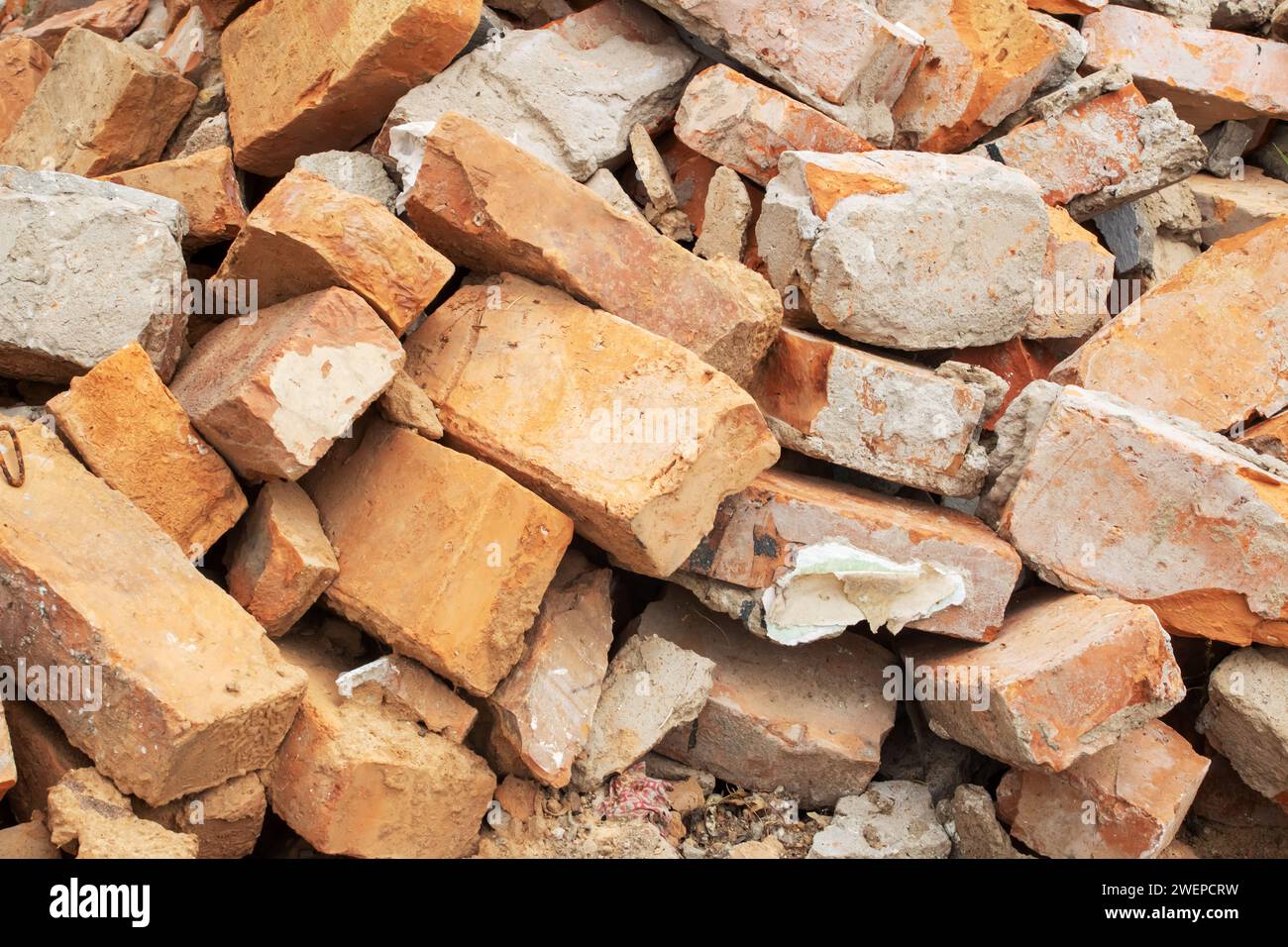 Old broken bricks in a pile, background or texture Stock Photo - Alamy