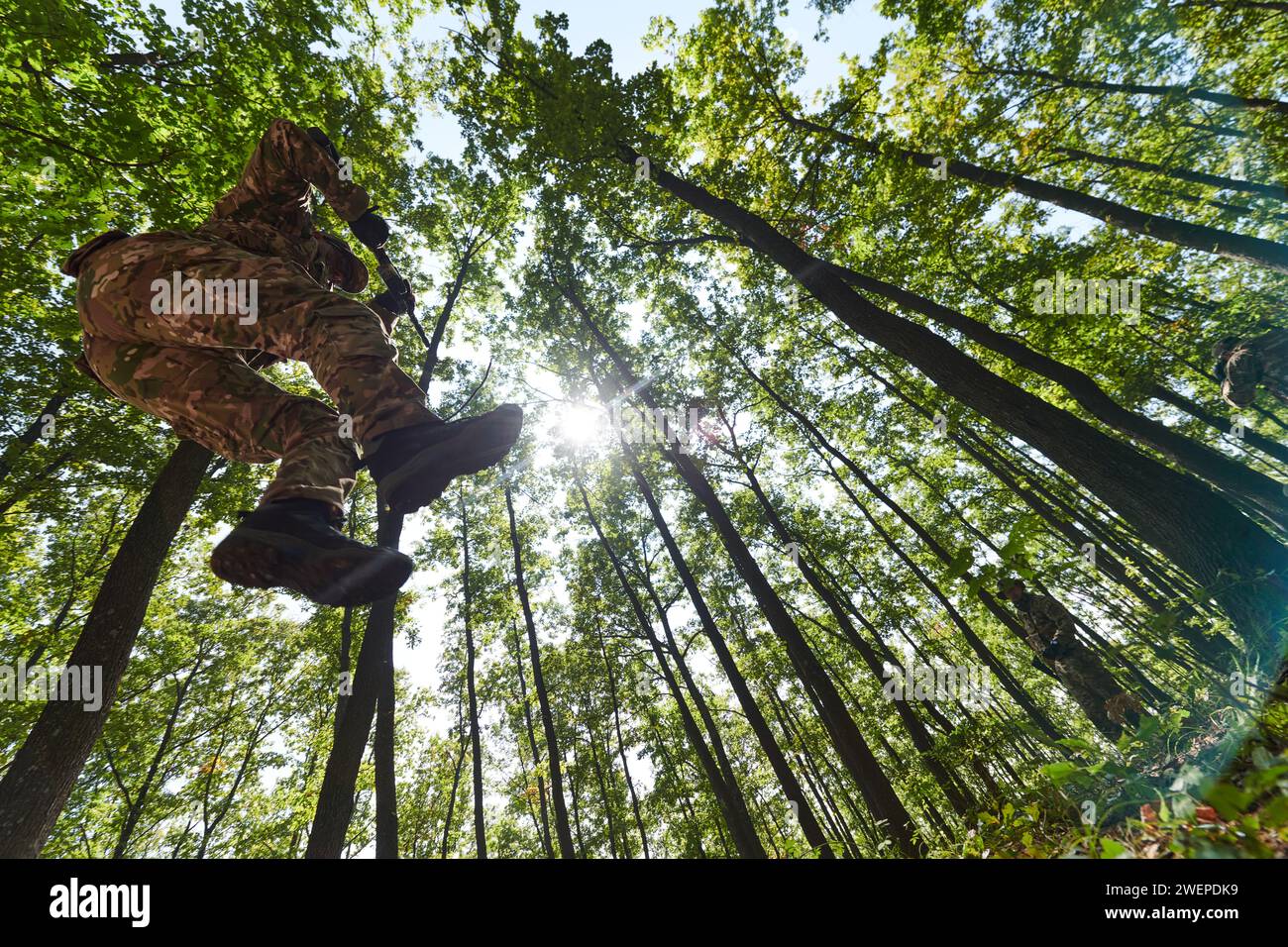 An elite soldier adeptly clears military barriers in the perilous ...