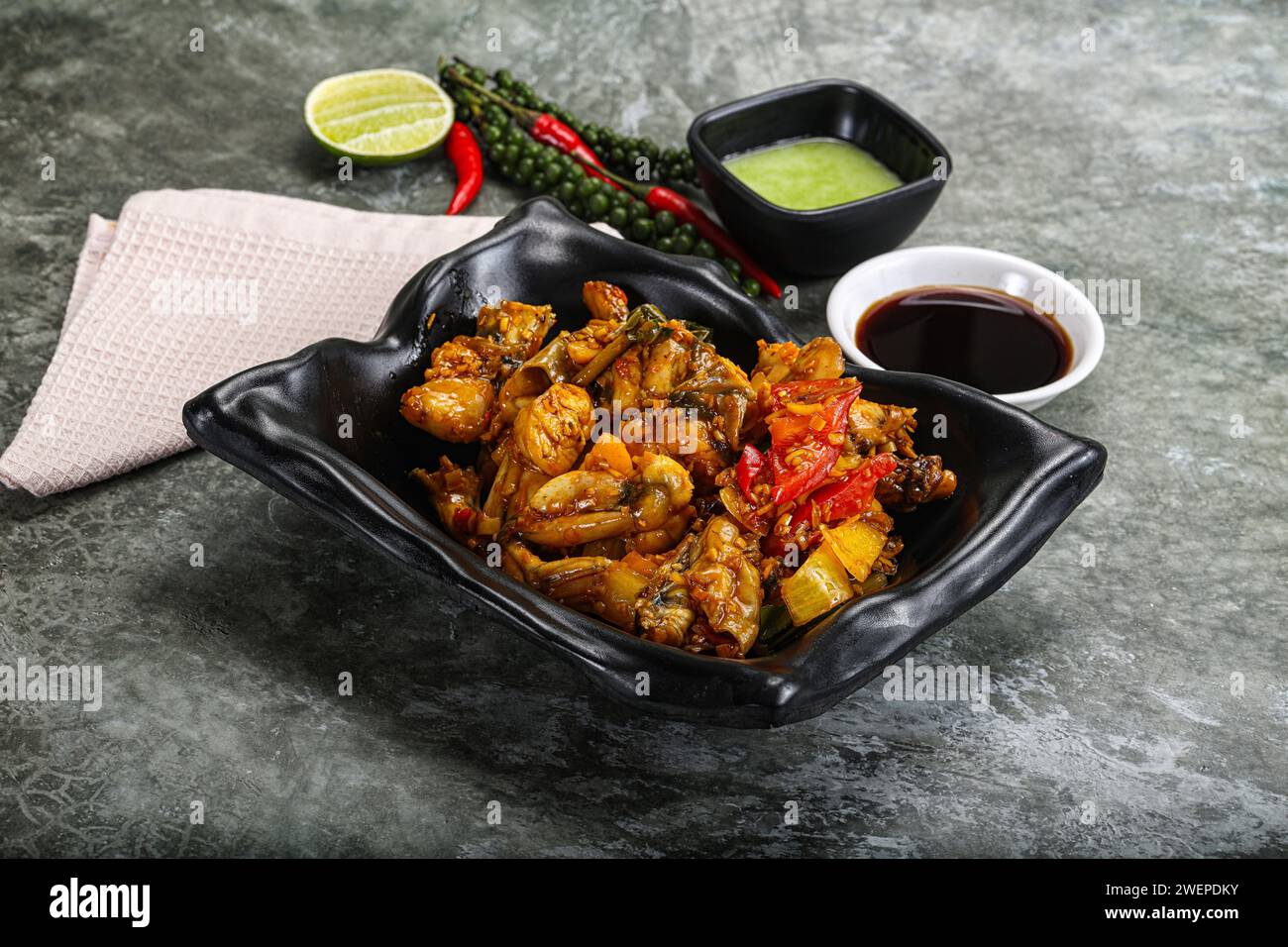 Vietnamese cuisine - fried frog with vegetables and spices Stock Photo ...