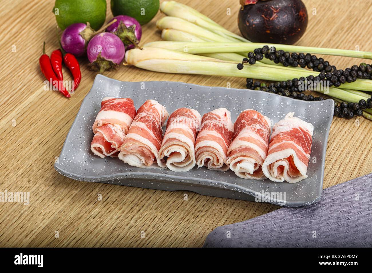 Raw beef bacon roll for grill Stock Photo - Alamy