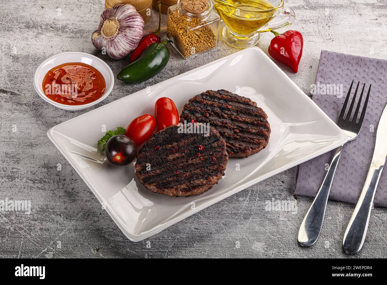 Grilled beef burger cutlet with sauce Stock Photo - Alamy
