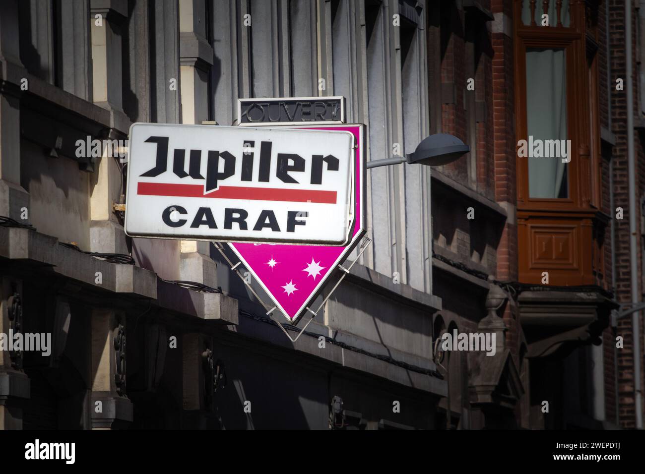 Picture of a sign with the logo of Jupiler on their retailer in Liege ...