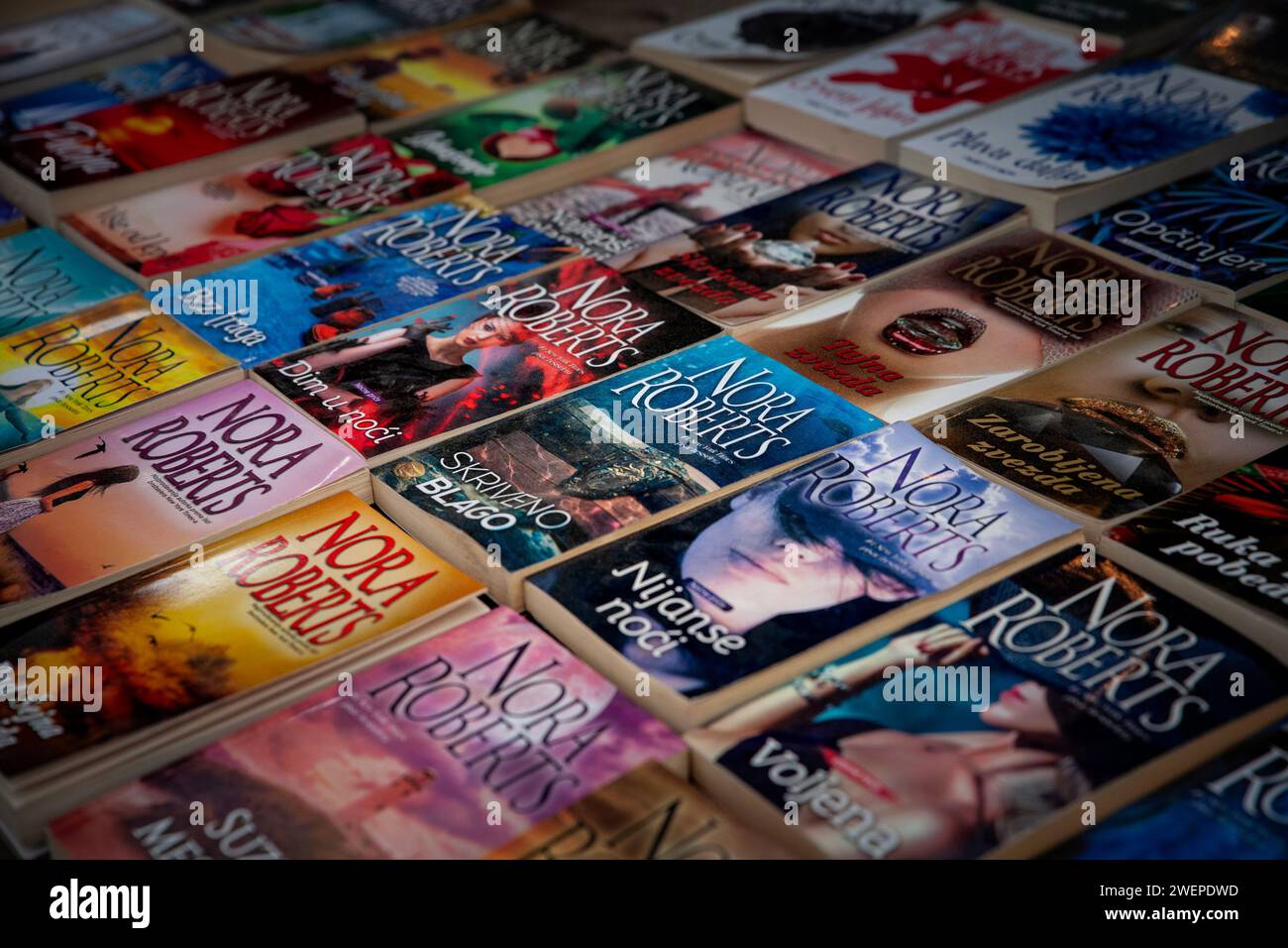 Picture of plenty of books of Nora Roberts on a shelf of a bookstore in ...