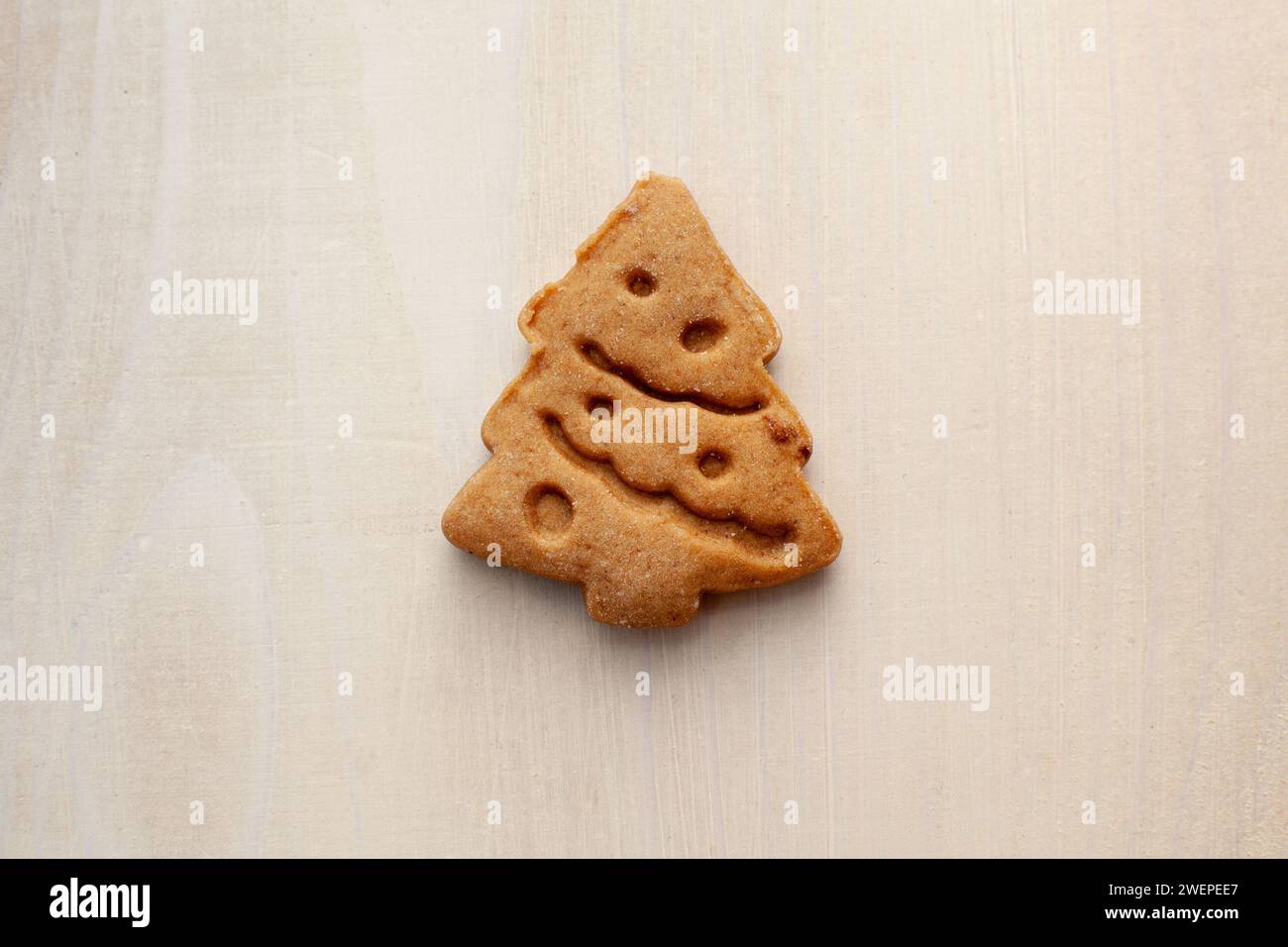 christmas tree shaped cookie on white background Stock Photo - Alamy