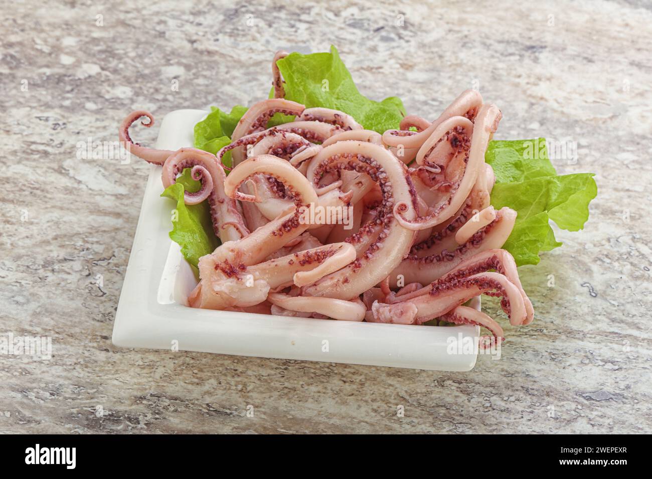 Marinated squid kalamri tentacles in the bowl Stock Photo - Alamy