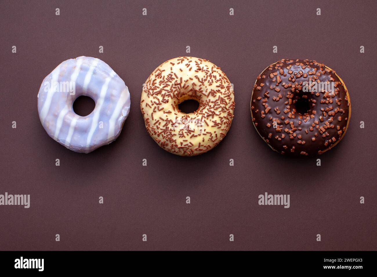 Three sweet doughnuts chocolate hi-res stock photography and images - Alamy