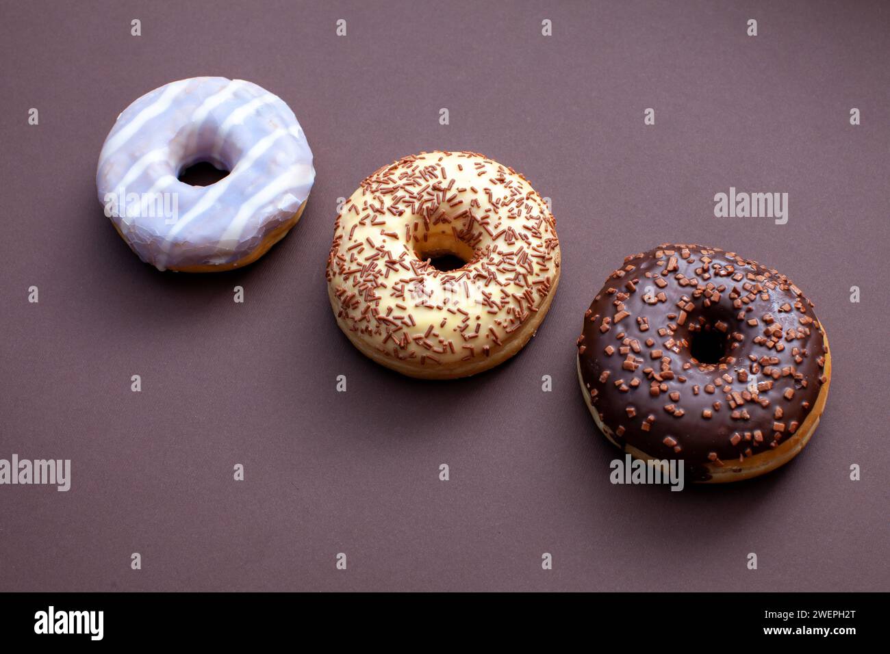 Three sweet doughnuts chocolate hi-res stock photography and images - Alamy