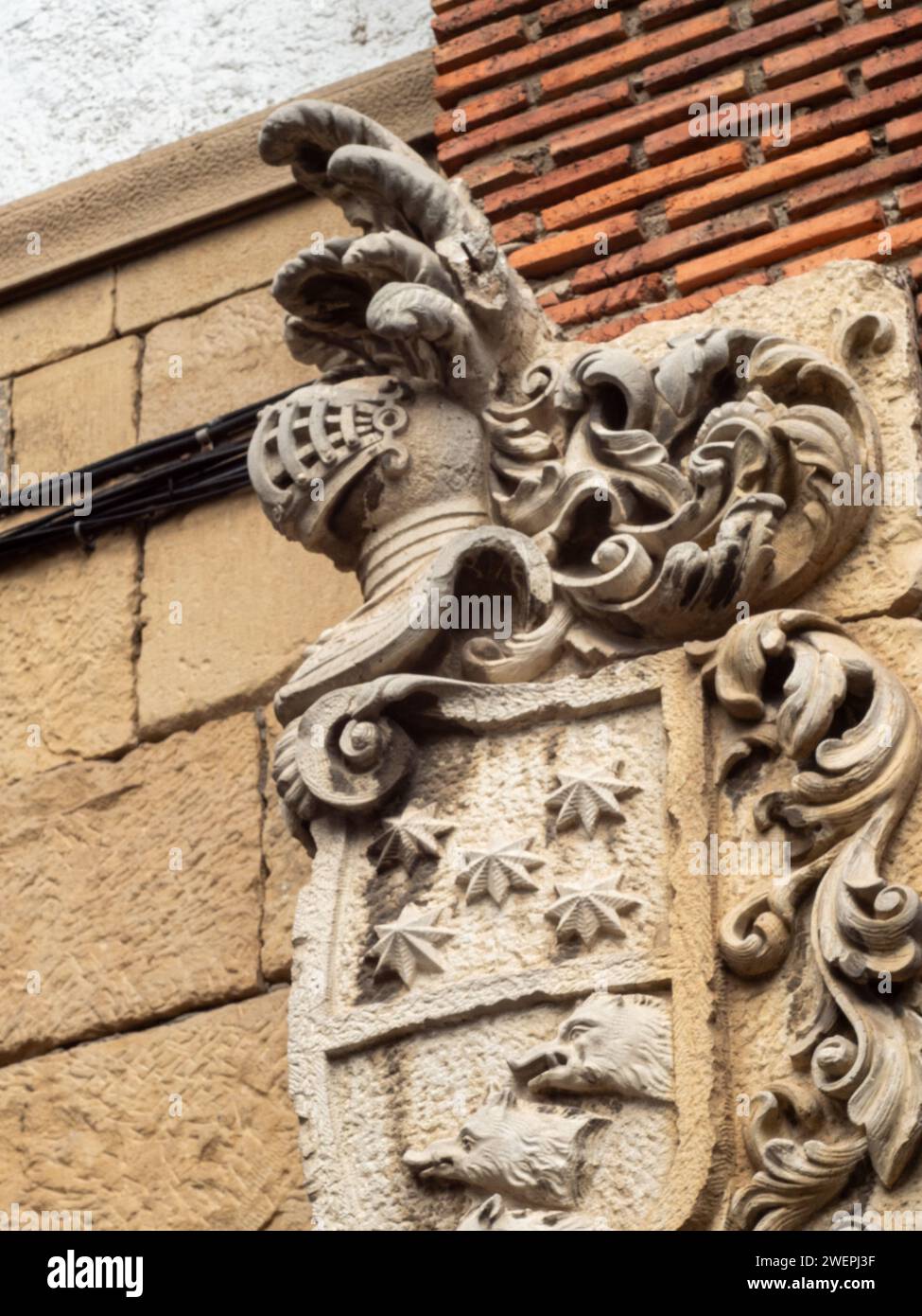 Decorative crest of a building, showcasing ornate arms Stock Photo - Alamy