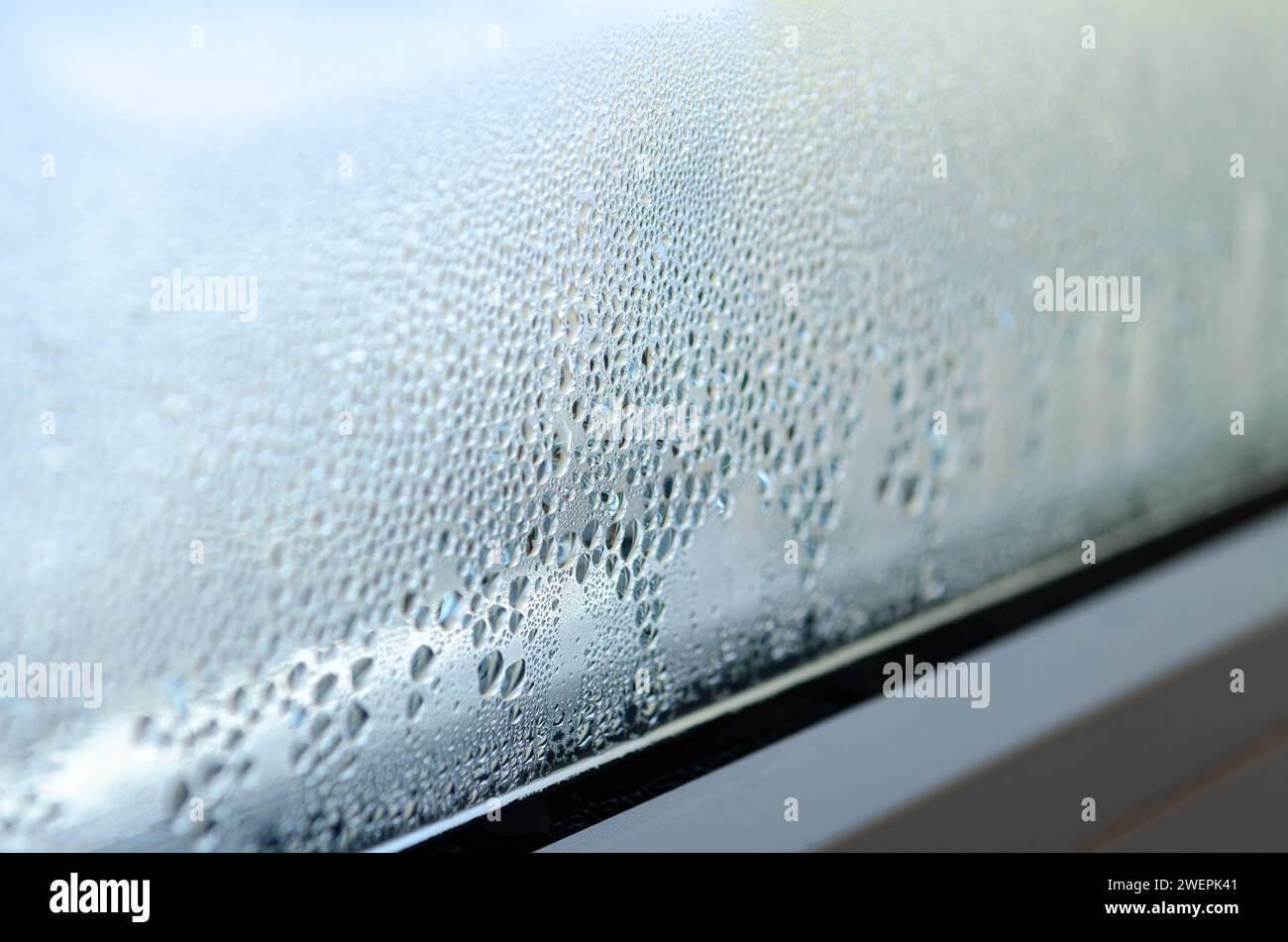 Greenhouse effect. Drops of condensation on the glass of a metal ...