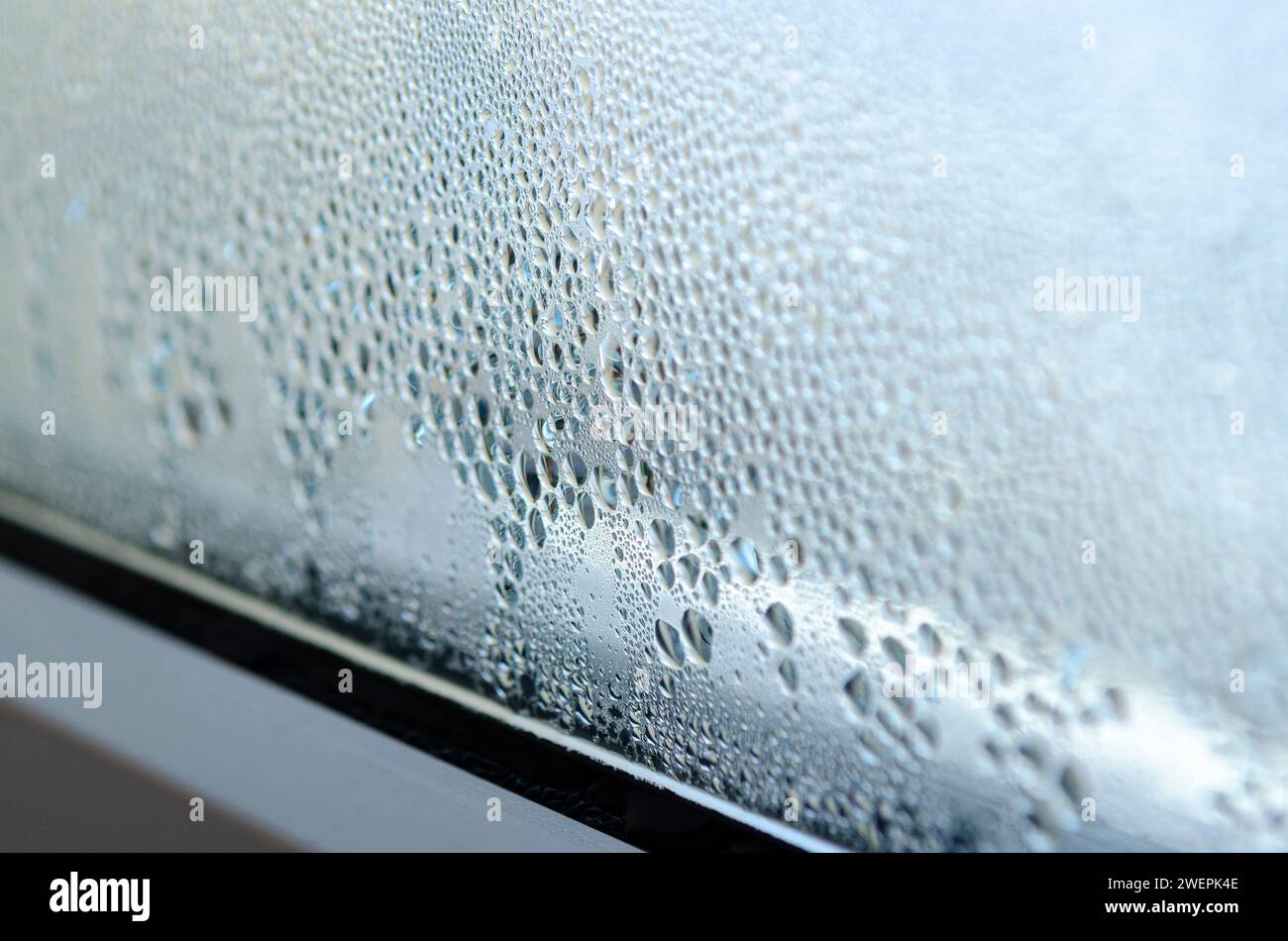 Greenhouse effect. Drops of condensation on the glass of a metal ...