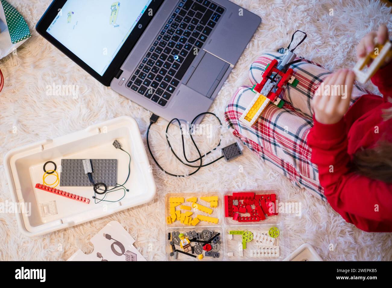Tallinn, Estonia - December 25, 2023: Child building a moving Lego ...
