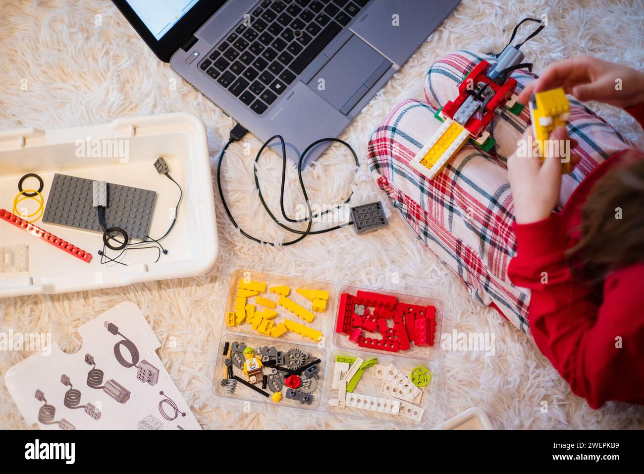 Tallinn, Estonia - December 25, 2023: Child building a moving Lego ...