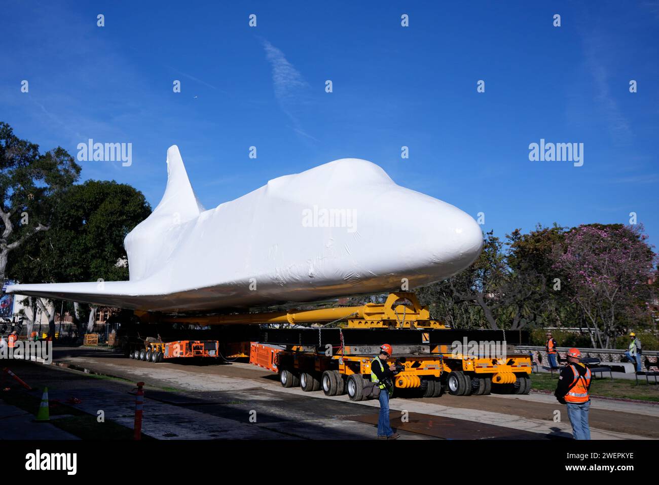 The retired NASA space shuttle Endeavor is moved on the grounds of the ...