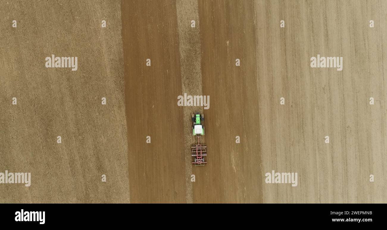 Agriculture- Tractor plowing GMO Free agricultural field 4K Stock Photo ...