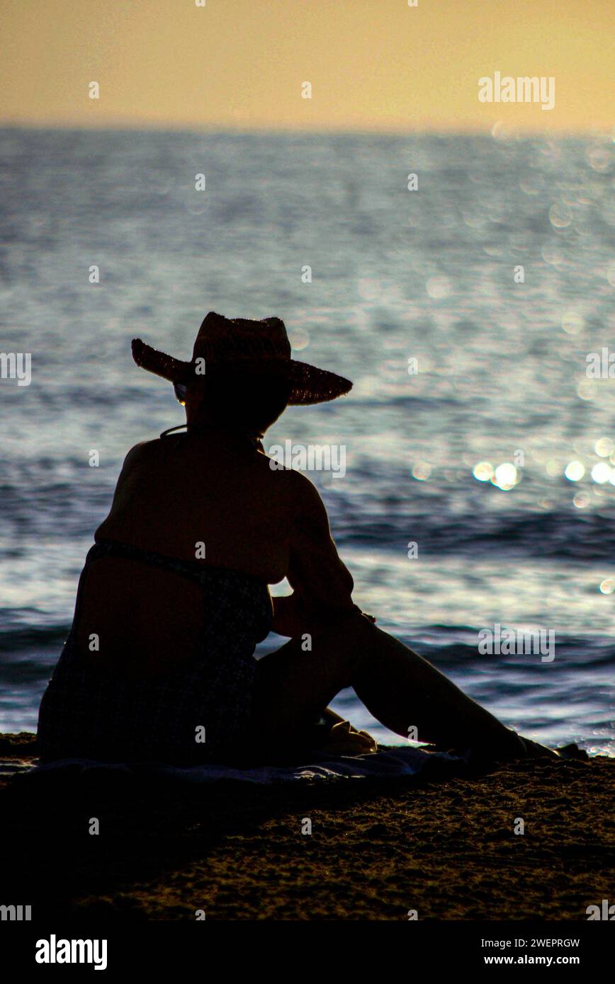 Senior woman looking at sunrise hi-res stock photography and images - Alamy
