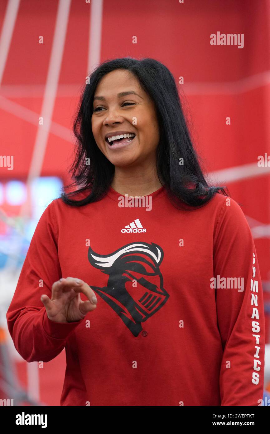 Women's gymnastics coach Umme Salim-Beasley participates in a team ...