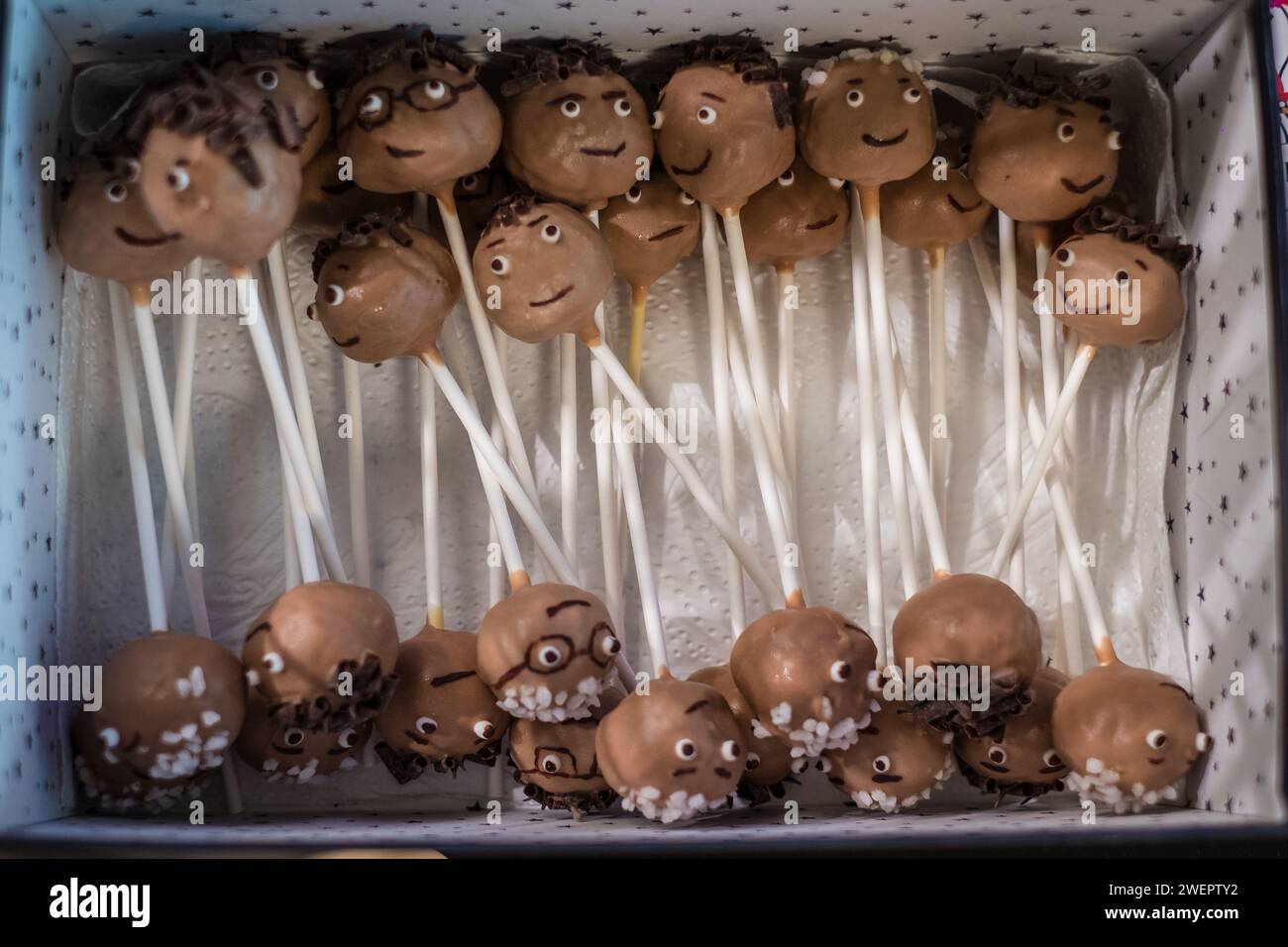 Fun cake on a stick with person's head design Stock Photo - Alamy
