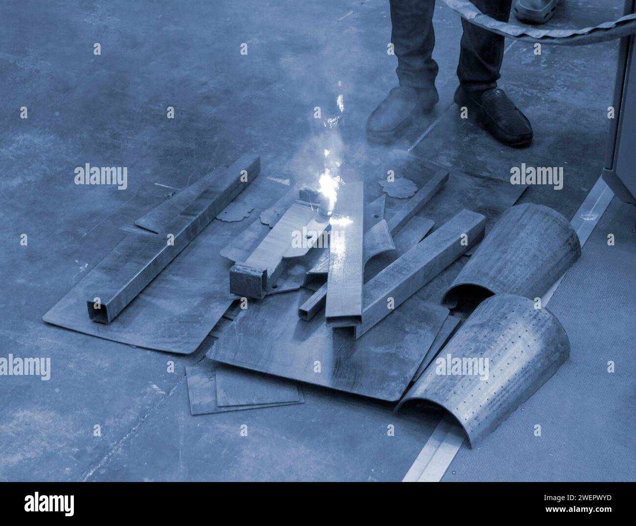 Laser cleaning of metal. The laser beam cleans the metal surface from ...