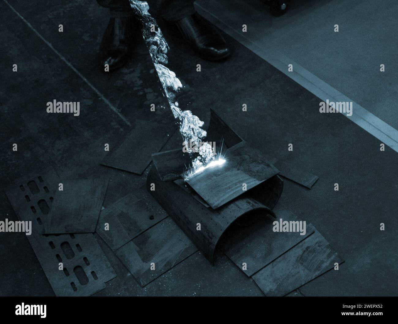 Laser cleaning of metal. The laser beam cleans the metal surface from ...