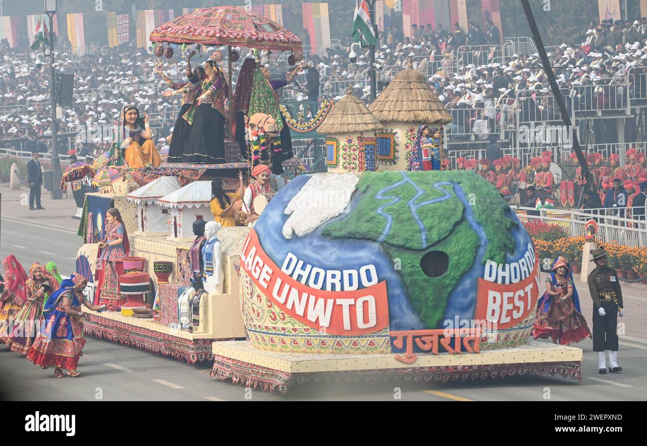 NEW DELHI, INDIA - JANUARY 26: Artists perform beside the tableaux of Gujarat state during the ...