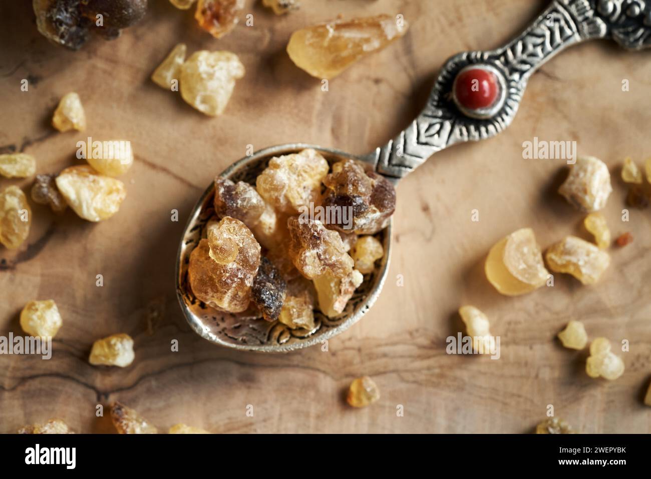 Frankincense resin crystals on a spoon, top view Stock Photo - Alamy