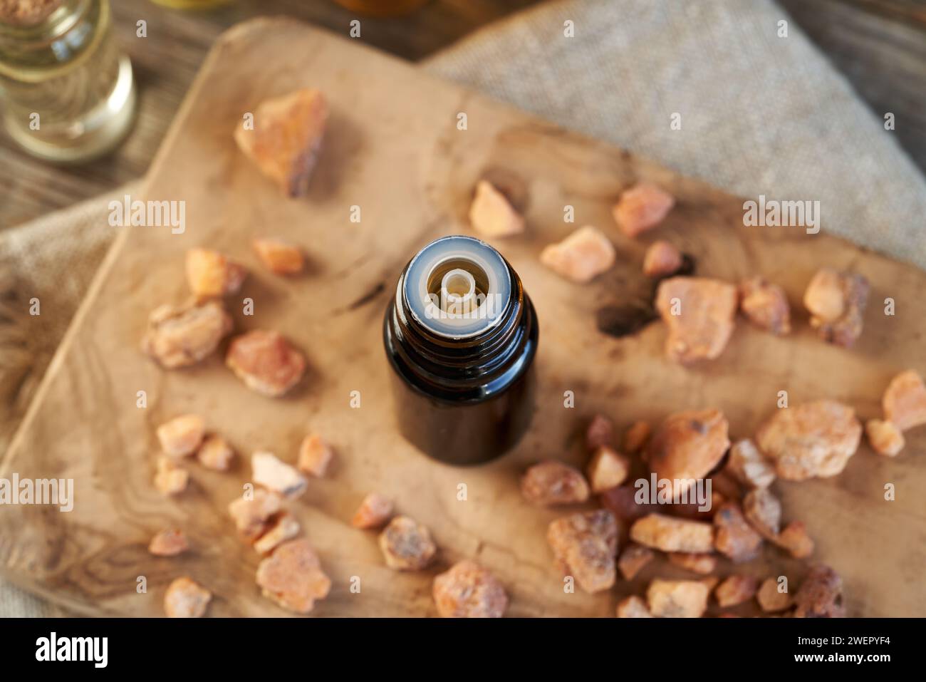 A brown bottle of essential oil with styrax benzoin resin Stock Photo ...