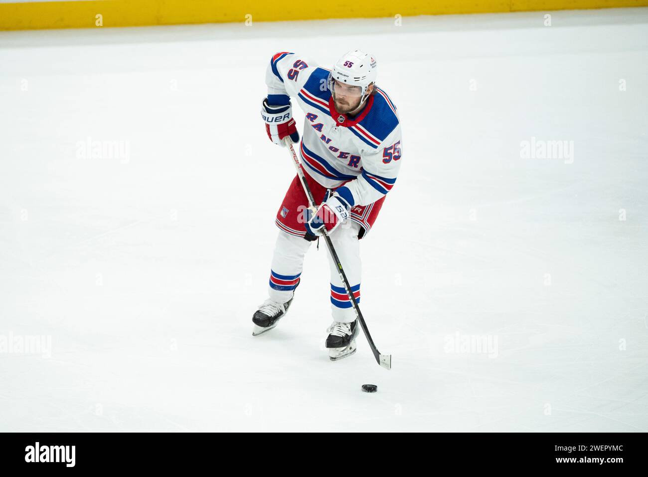 New York Rangers defenseman Ryan Lindgren (55) controls the puck during ...