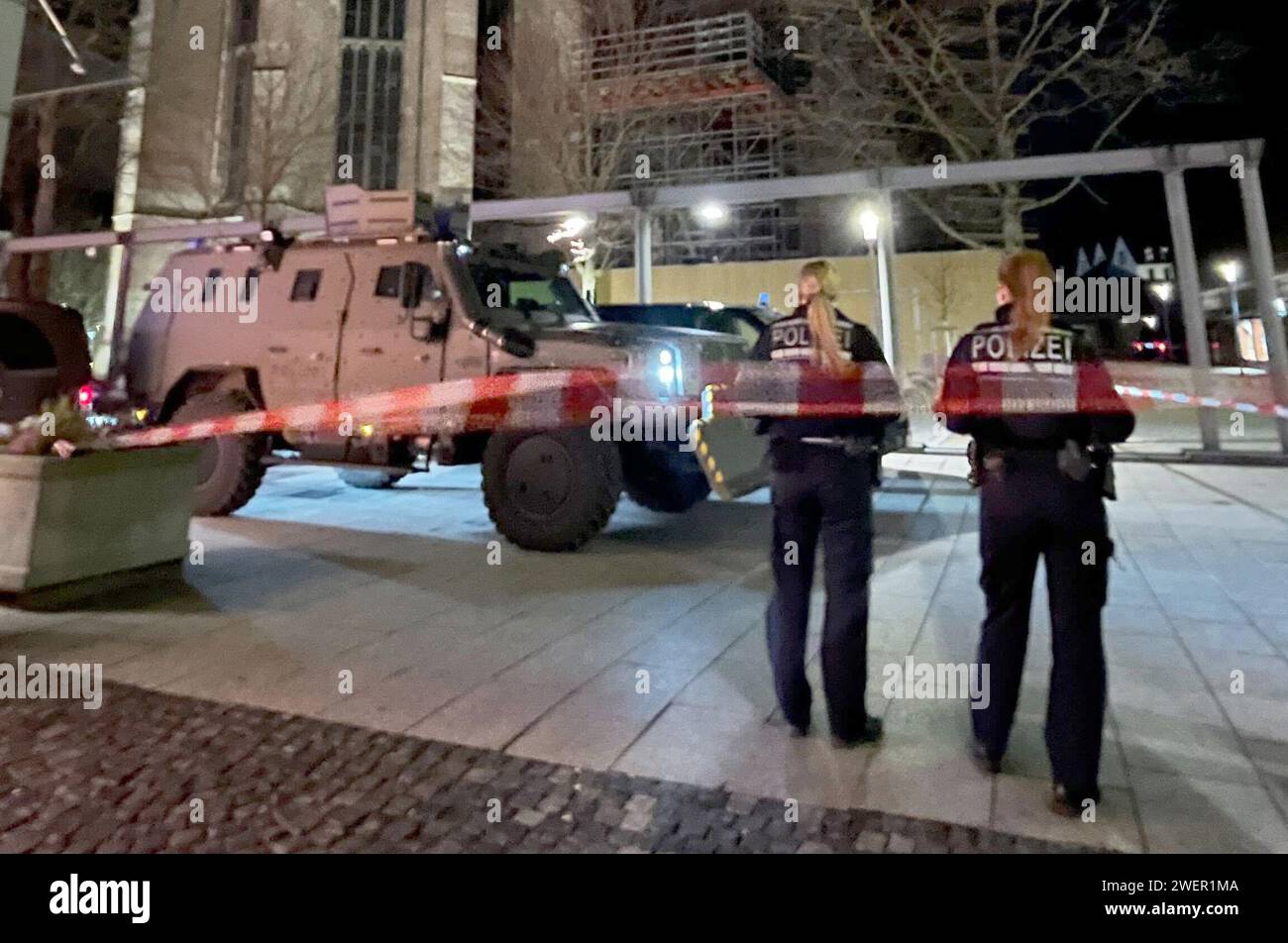 Ulm, Germany. 26th Jan, 2024. Two policewomen stand behind a police ...