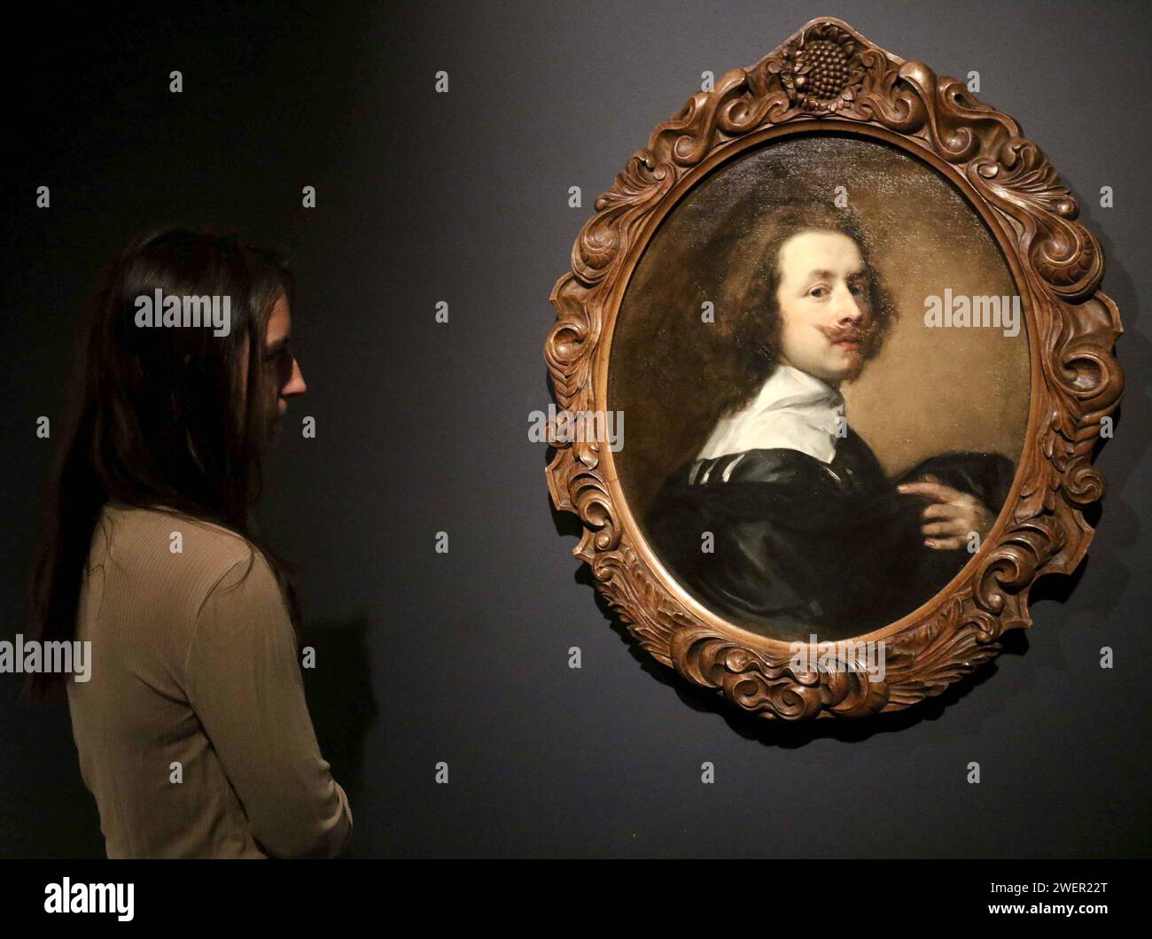 New York, New York, USA. 26th Jan, 2024. A woman looks at a Van Dyck 'Self Portrait with ...