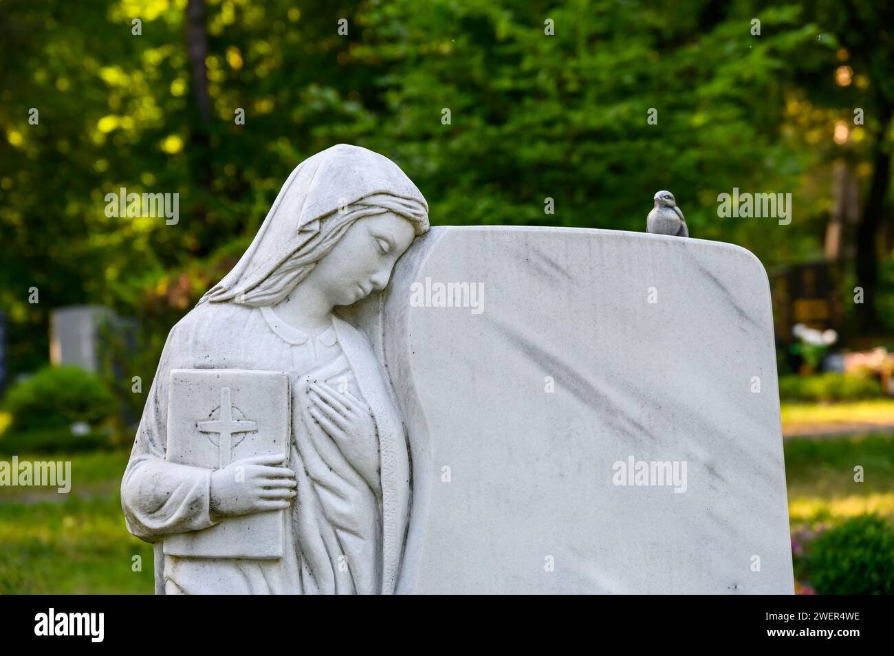 Statue of woman with book on gravestone with text space Stock Photo - Alamy