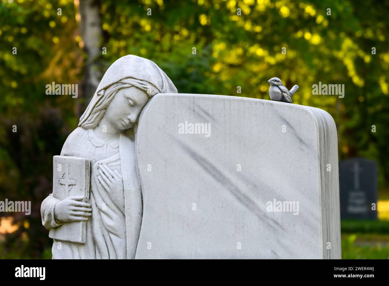 Statue of woman with book on gravestone with text space Stock Photo - Alamy
