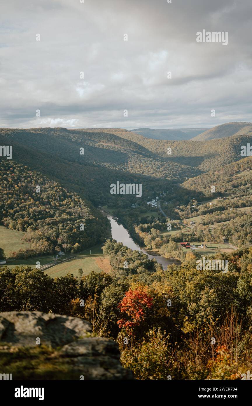 A stunning scenic landscape showcasing a river flowing through a valley ...