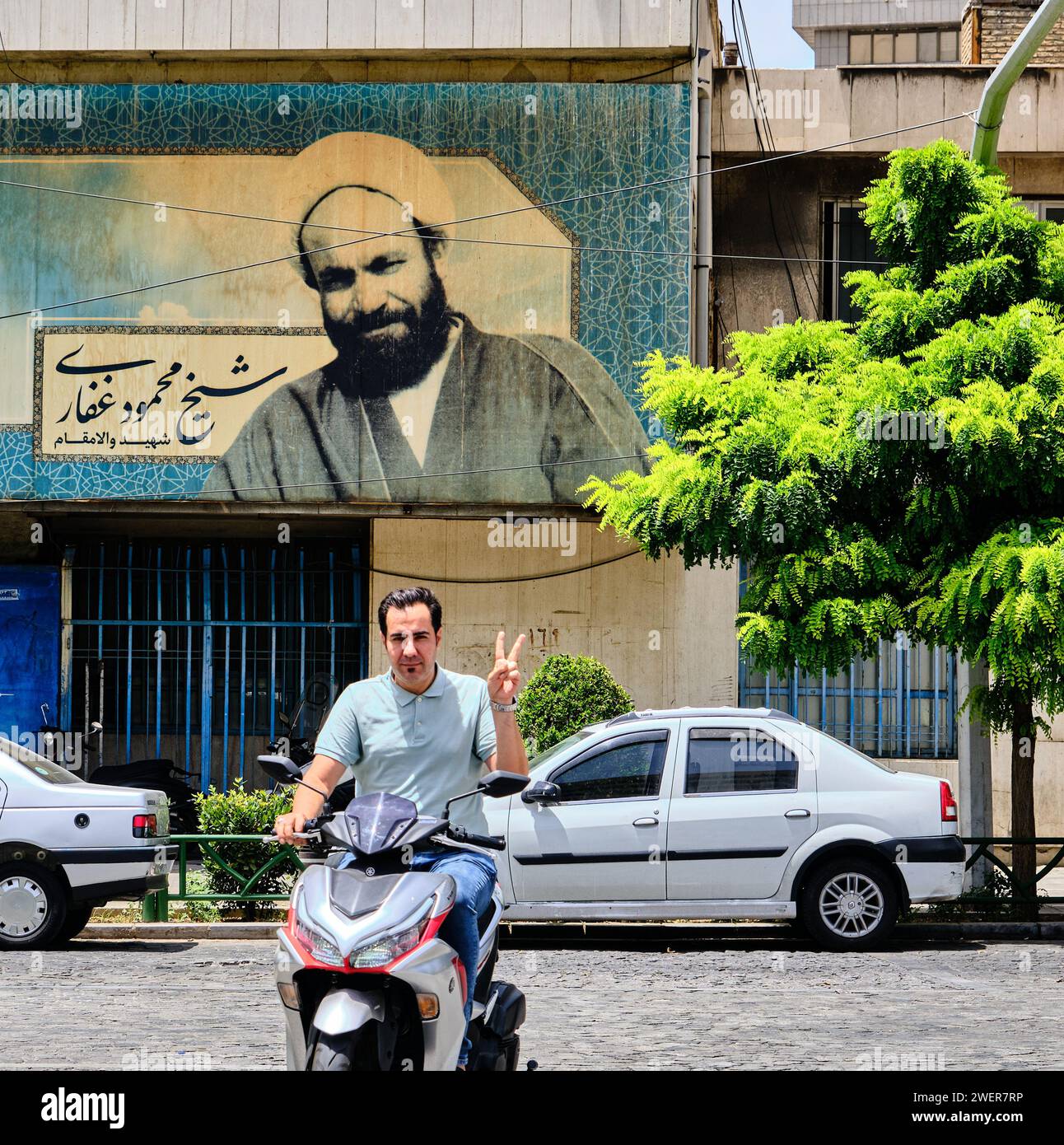 Tehran (Teheran), Iran, 06.24.2023: An iranian man make victory sign ...
