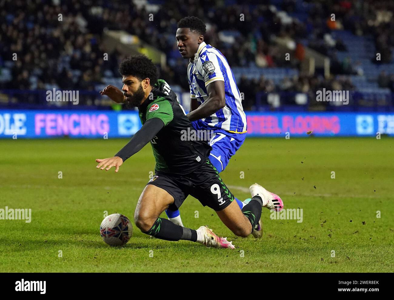 Coventry City's Ellis Simms and challenged by Sheffield Wednesday's Di ...