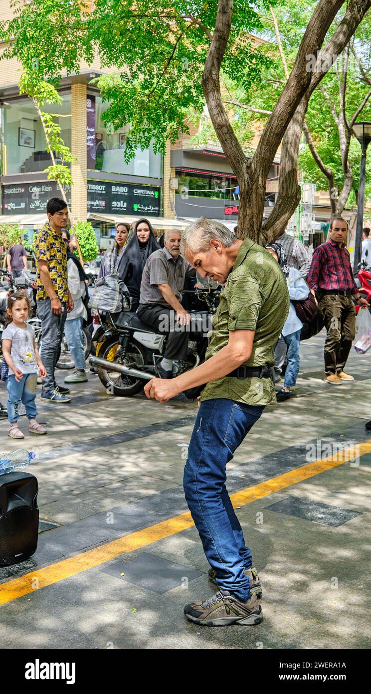 Tehran (Teheran), Iran, 06.24.2023: An old iranian man dancing on ...
