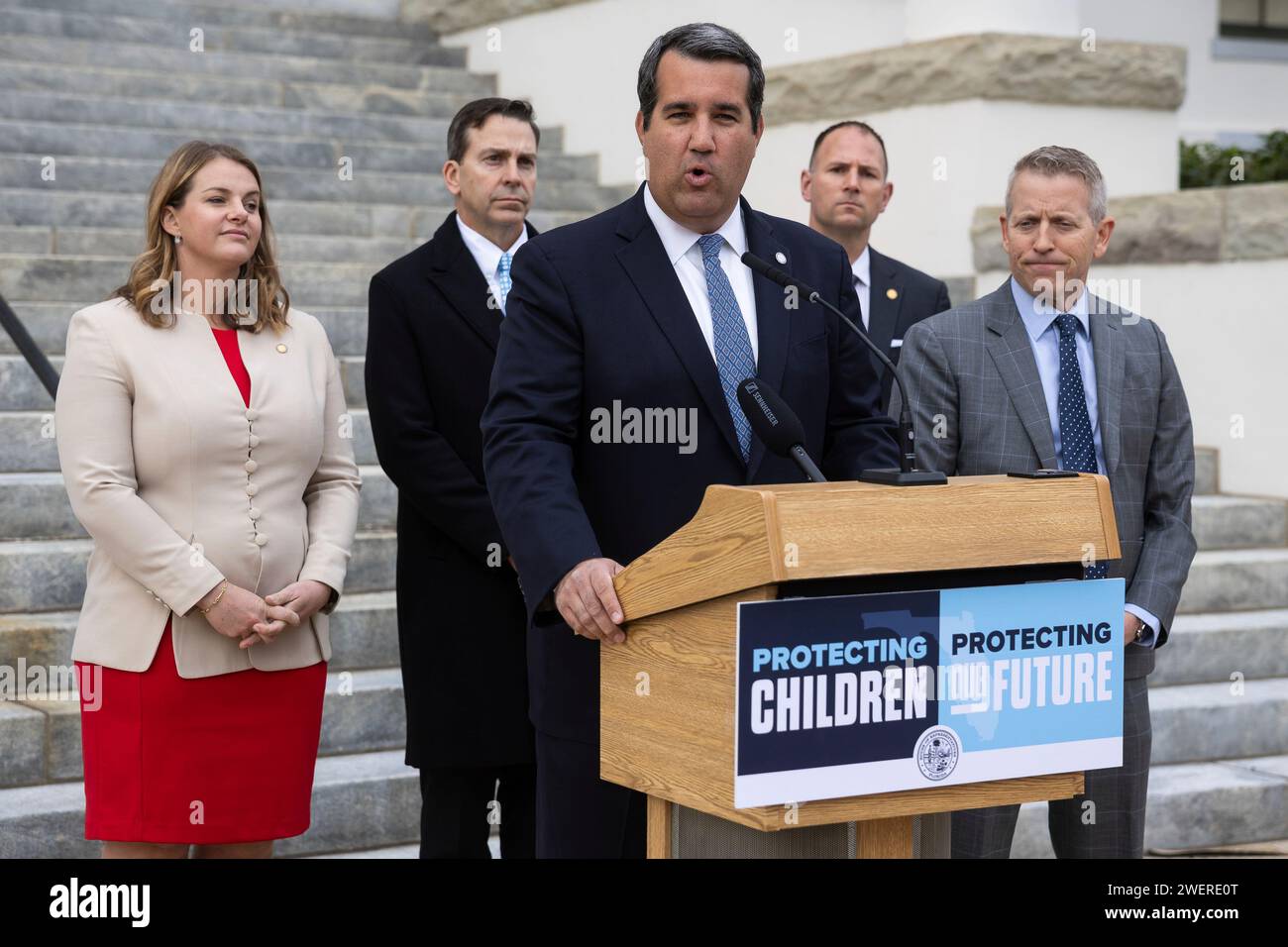 Florida State Rep. Tyler Sirois, flanked by Florida State Reps. Fiona ...