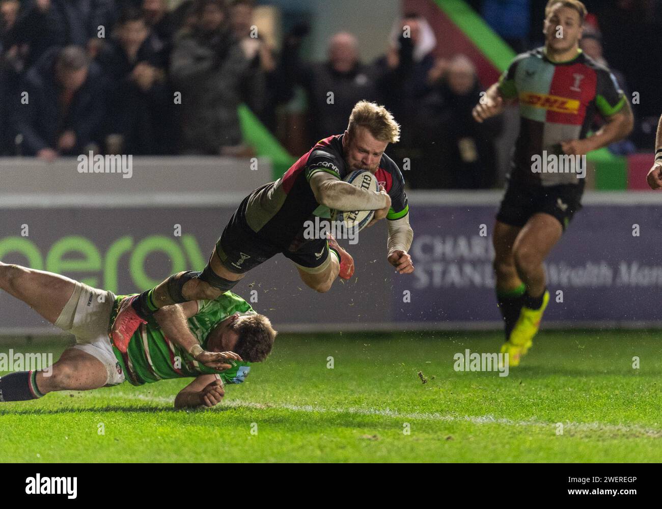 Tyrone Green of Harlequins dives in to score his sides third try during ...