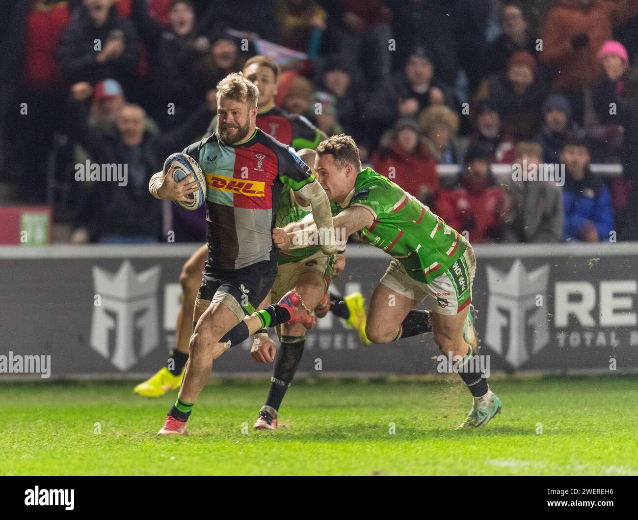 Tyrone Green of Harlequins makes a break to score his sides third try ...