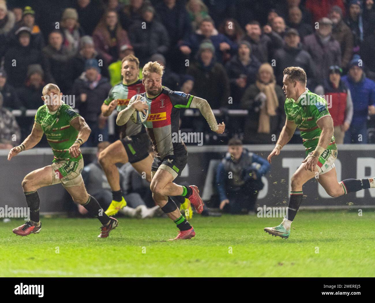 Tyrone Green of Harlequins makes a break to score his sides third try ...