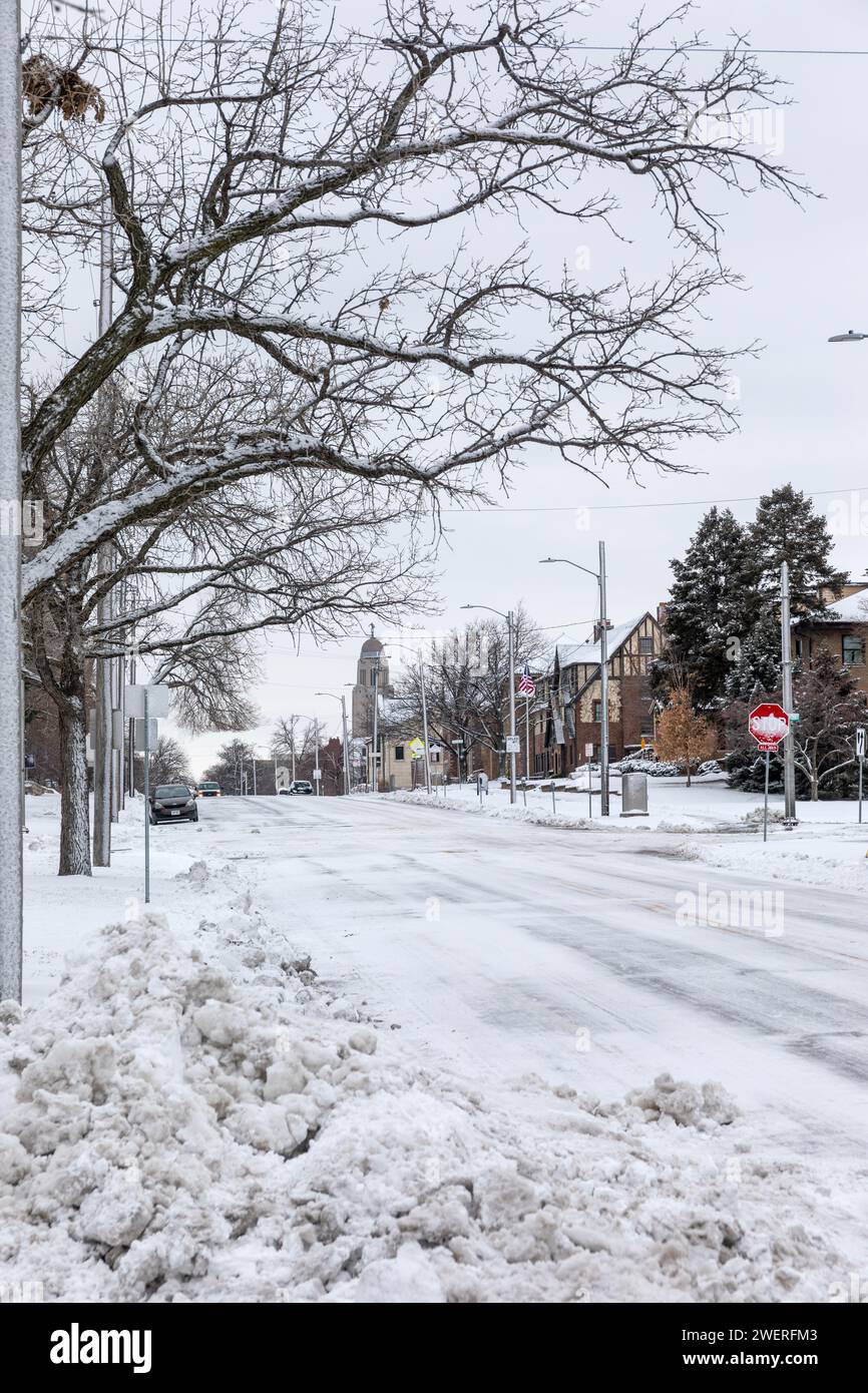 Snowy street in Lincoln, Nebraska USA, with the state capitol building ...